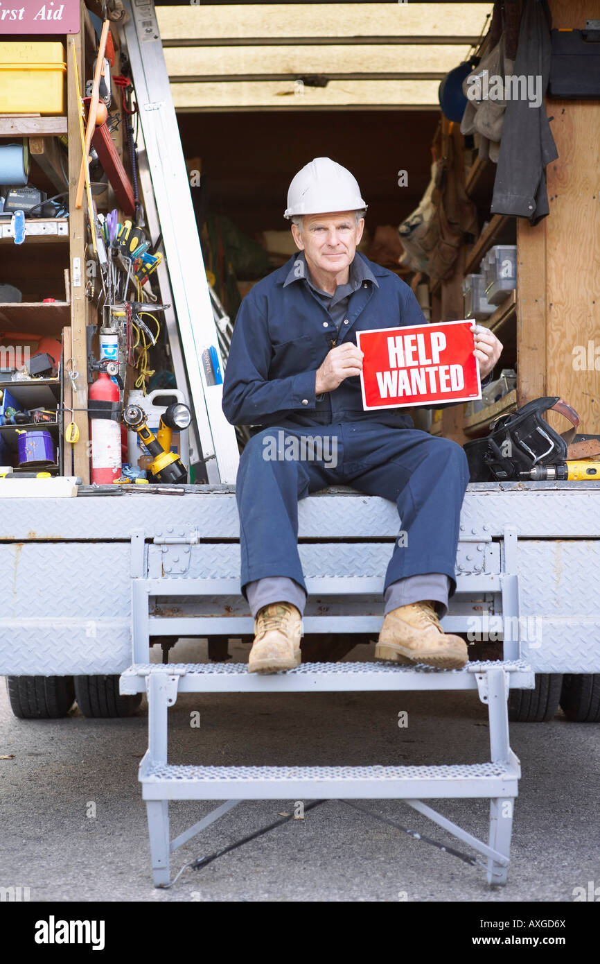 Construction worker ladder holding help hi-res stock photography and ...