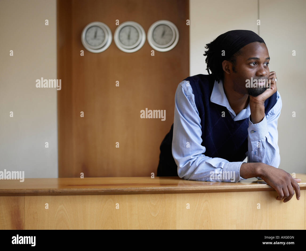 Portrait of Man Behind Desk Stock Photo - Alamy