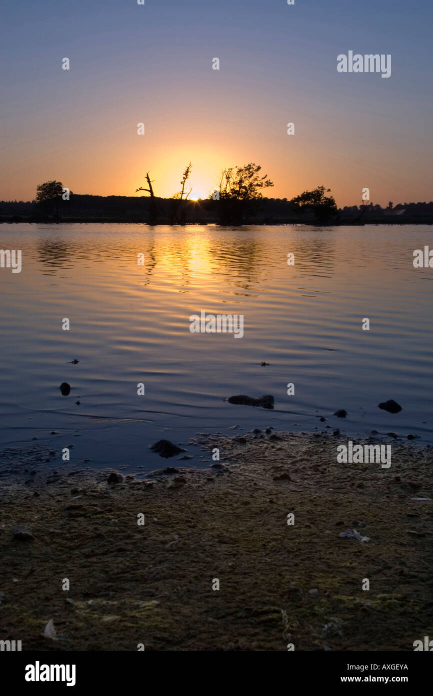 Serene wilderness lake during vibrant sunset hi-res stock photography ...