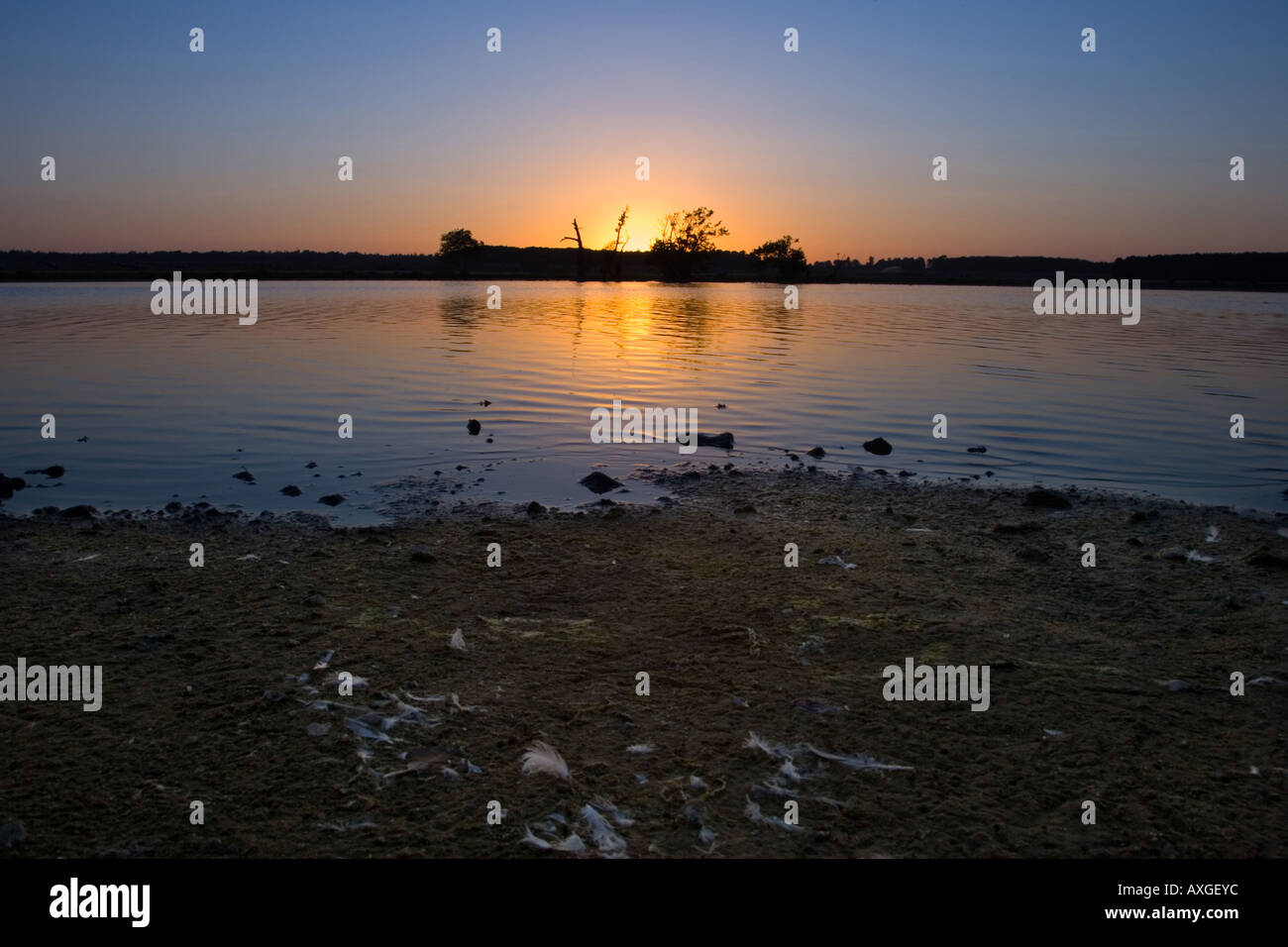 Serene wilderness lake during vibrant sunset hi-res stock photography ...