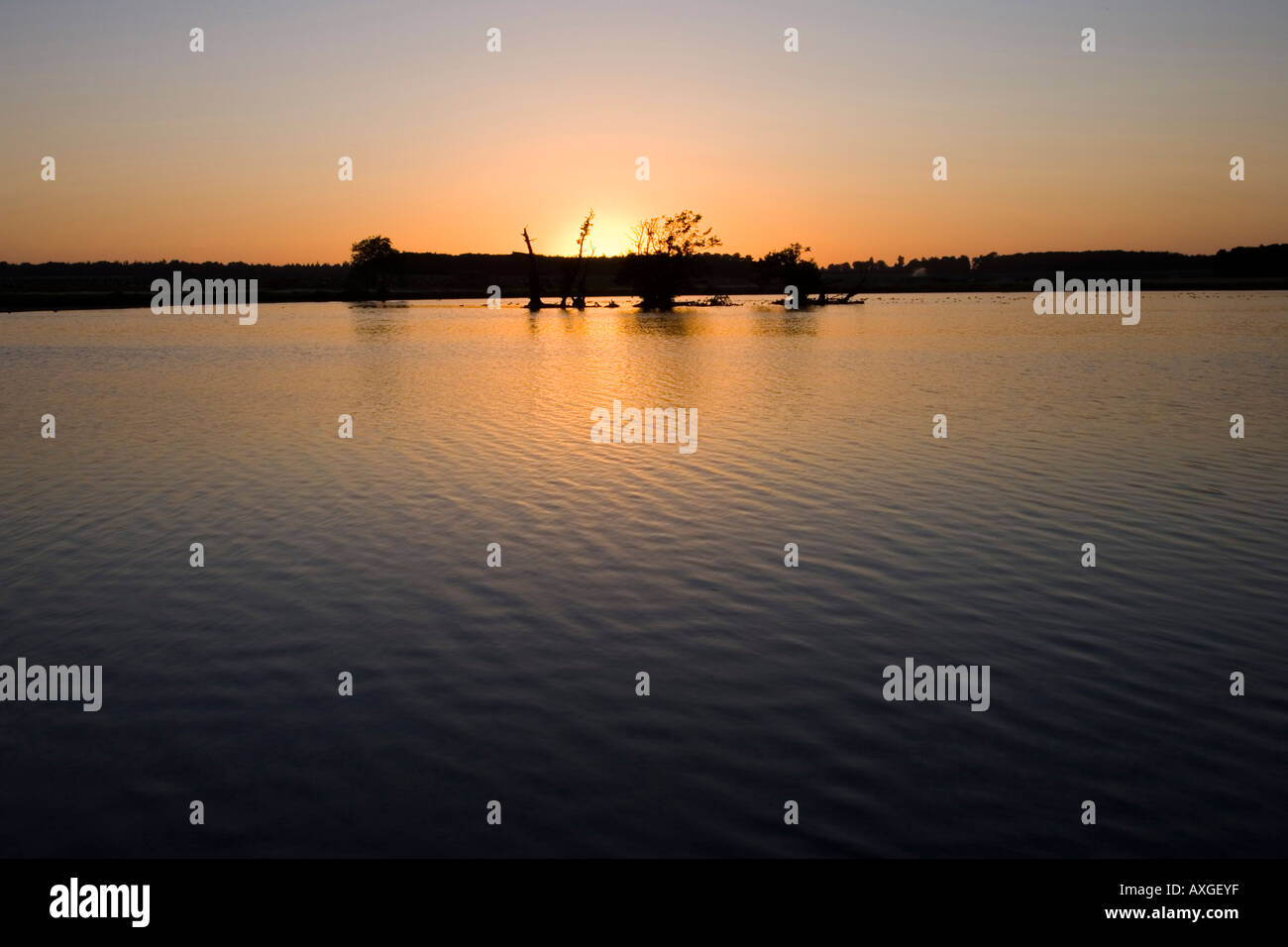 Serene wilderness lake during vibrant sunset hi-res stock photography ...