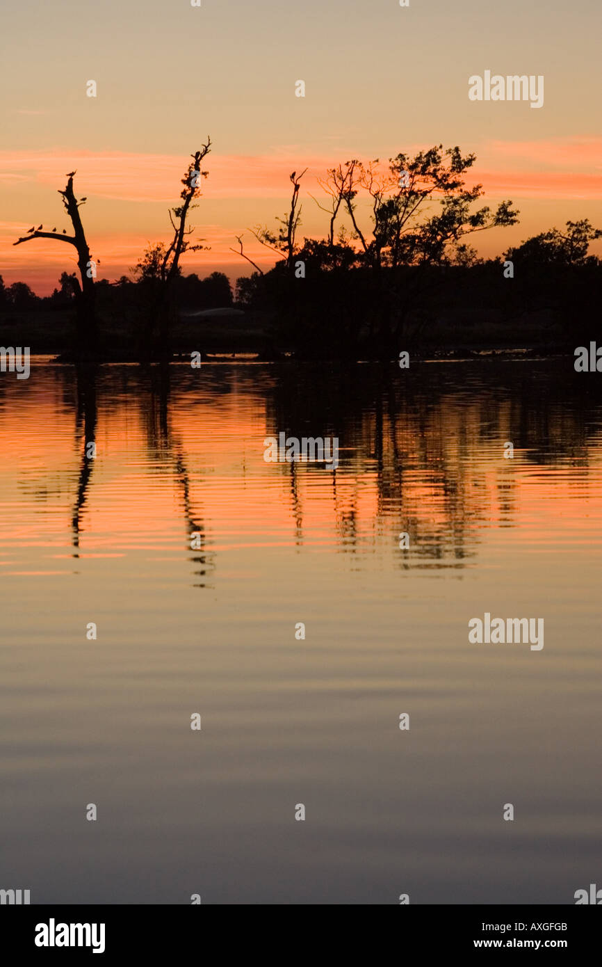 Serene wilderness lake during vibrant sunset hi-res stock photography ...