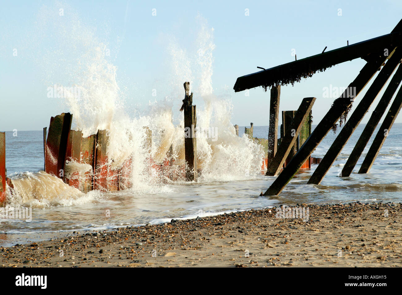 Wave Breaking Through Smashed and Rusting Sea Defences, Happisburgh ...