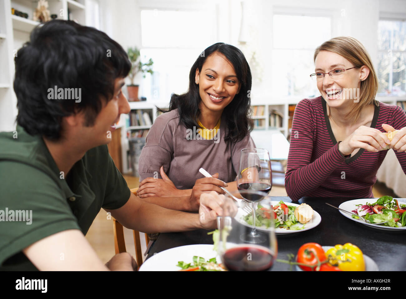 Three Adults At Dining Table High Resolution Stock Photography and ...