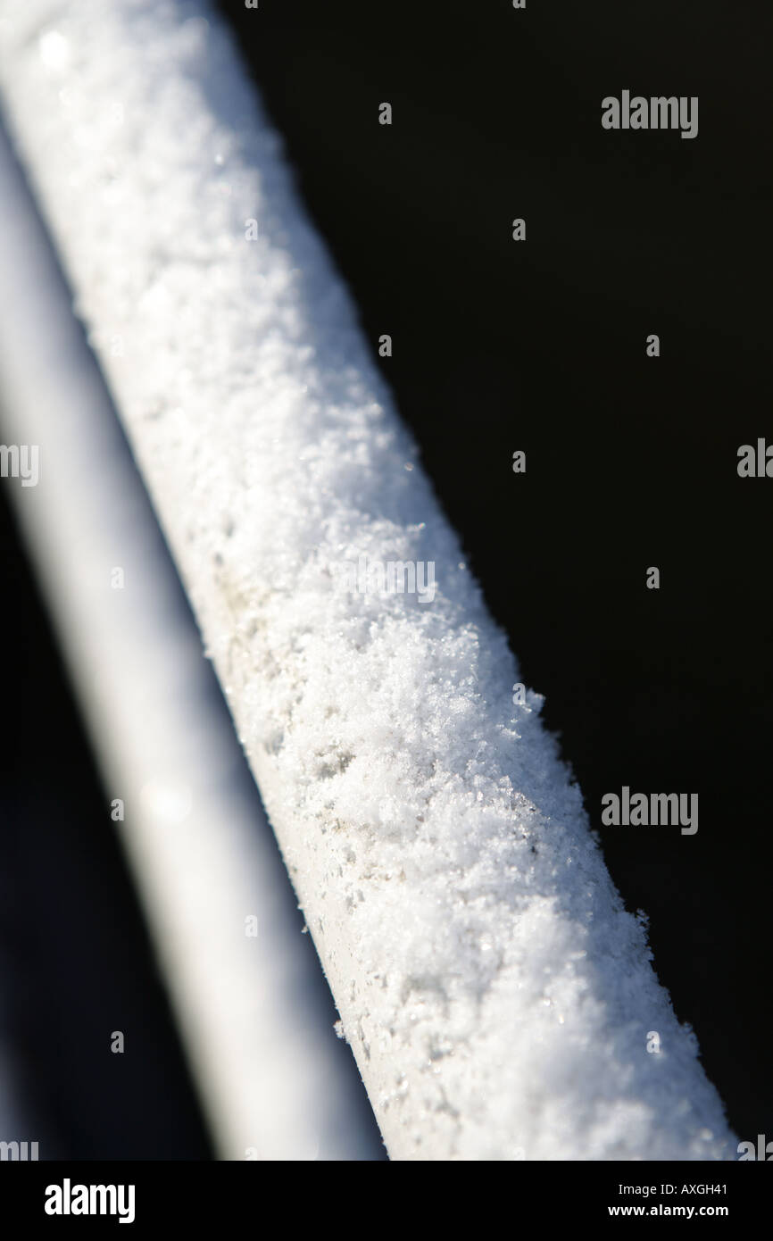 Snow on Metal Fence Stock Photo - Alamy