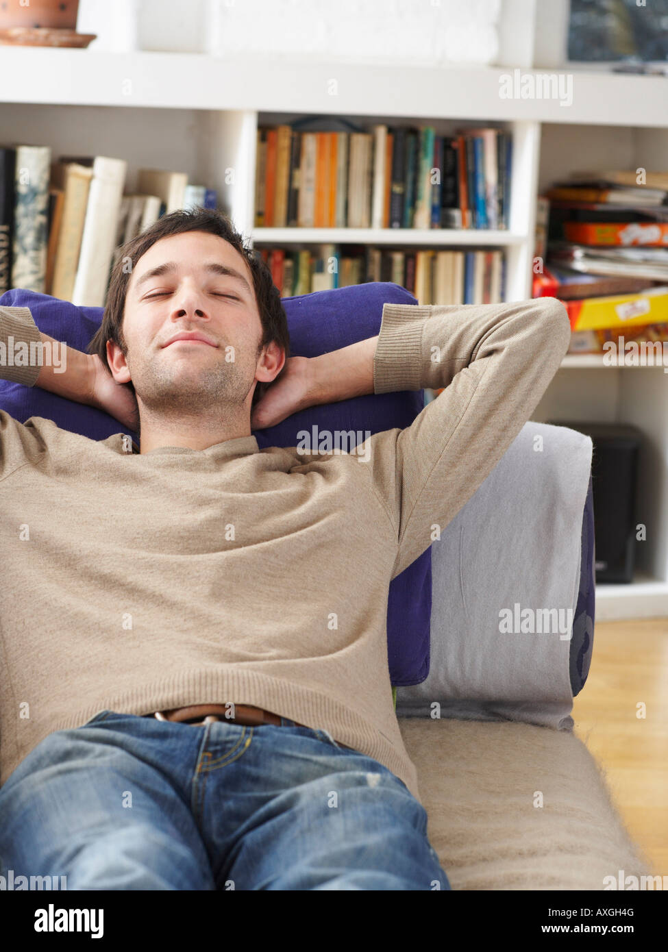 Man asleep on settee hi-res stock photography and images - Alamy