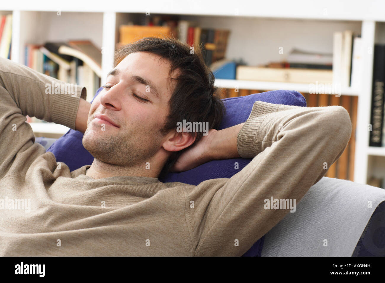 Man asleep on settee hi-res stock photography and images - Alamy