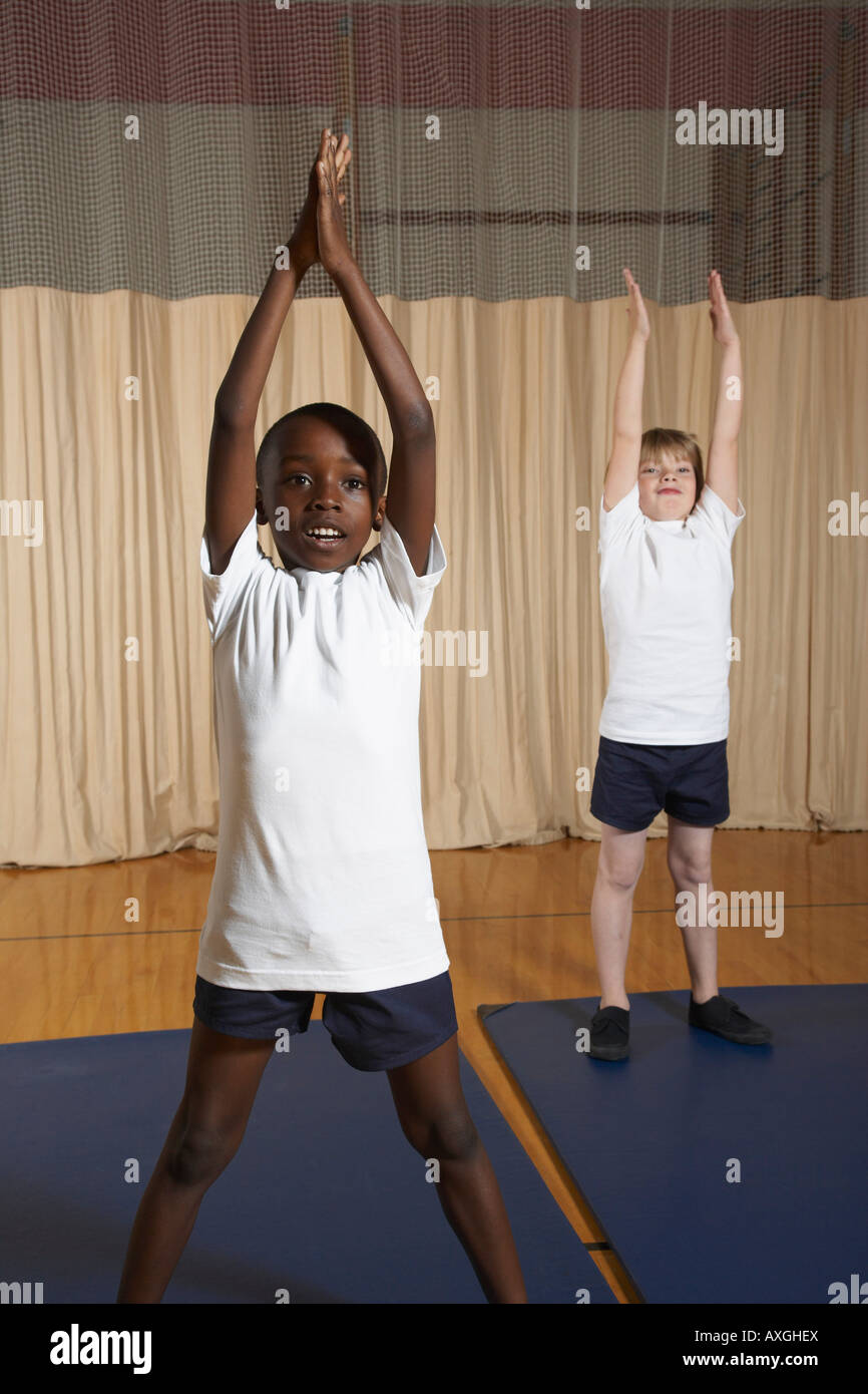 Kids stretching at school gym hi-res stock photography and images - Alamy