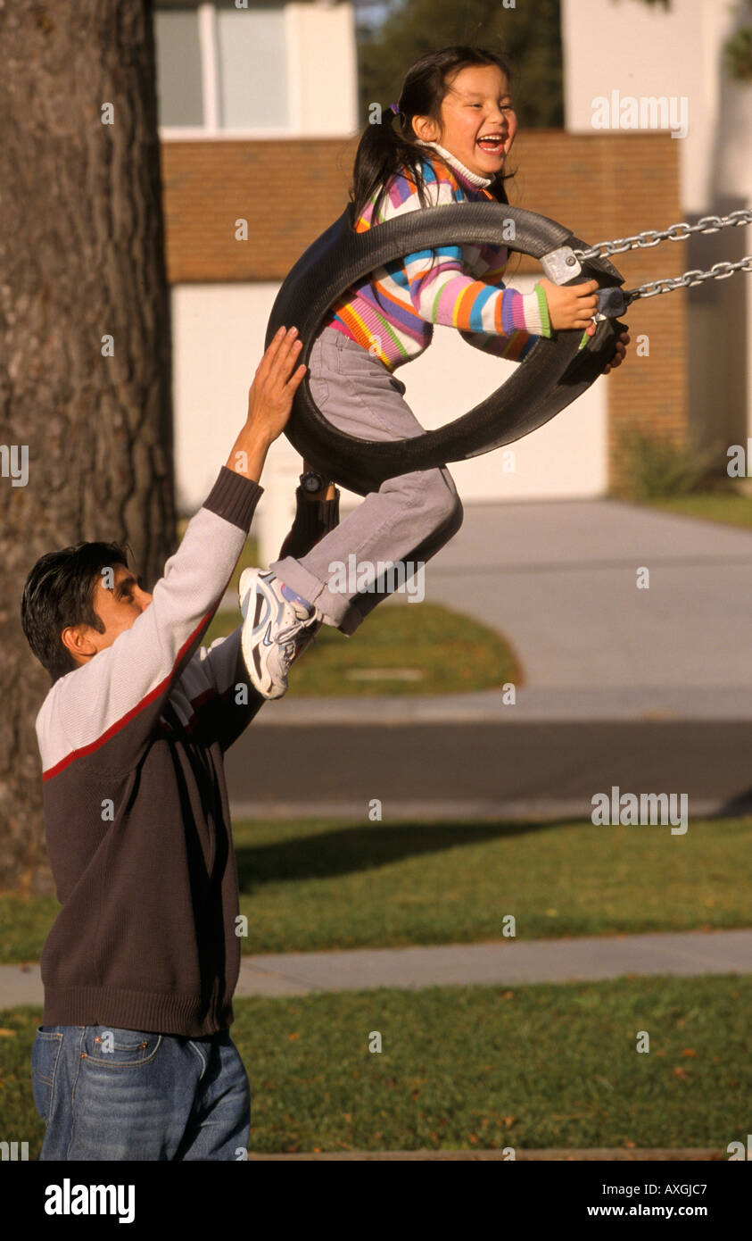 Girl playing on swing Melbourne Victoria Australia Vertical Stock Photo ...