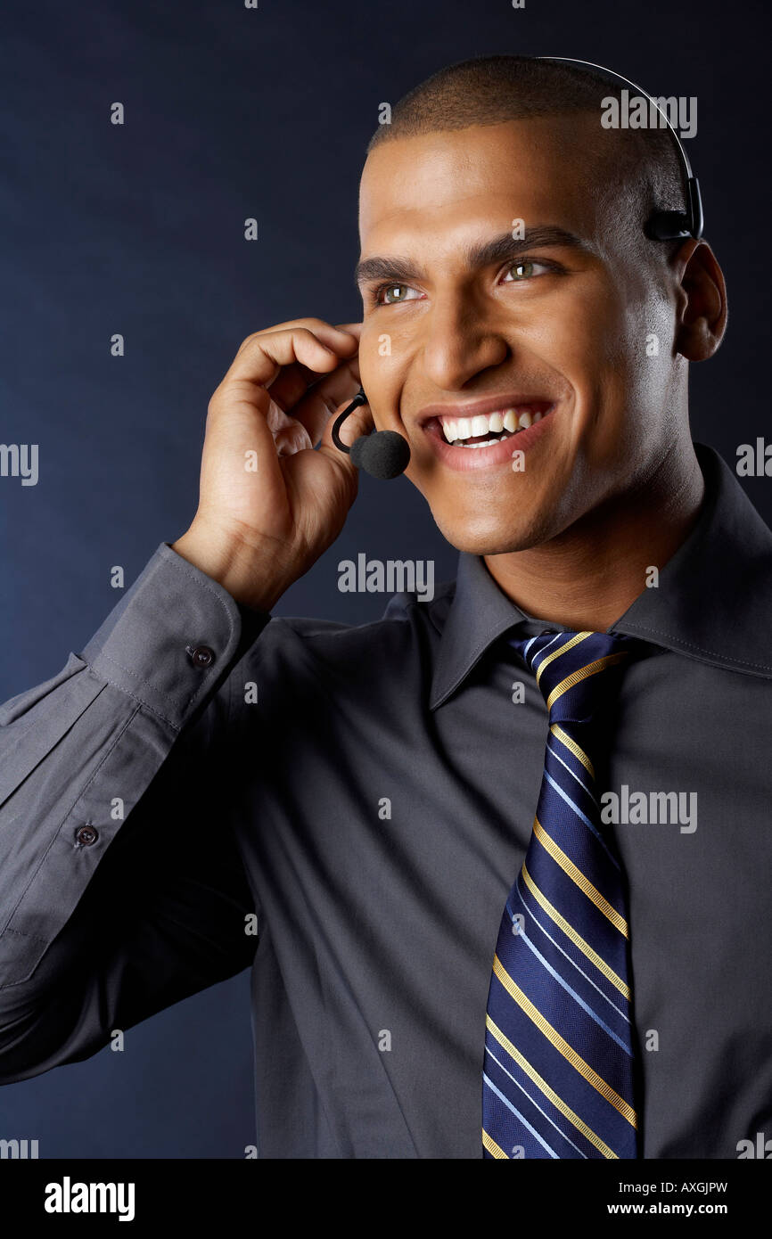 Happy Businessman Wearing Headset Stock Photo - Alamy
