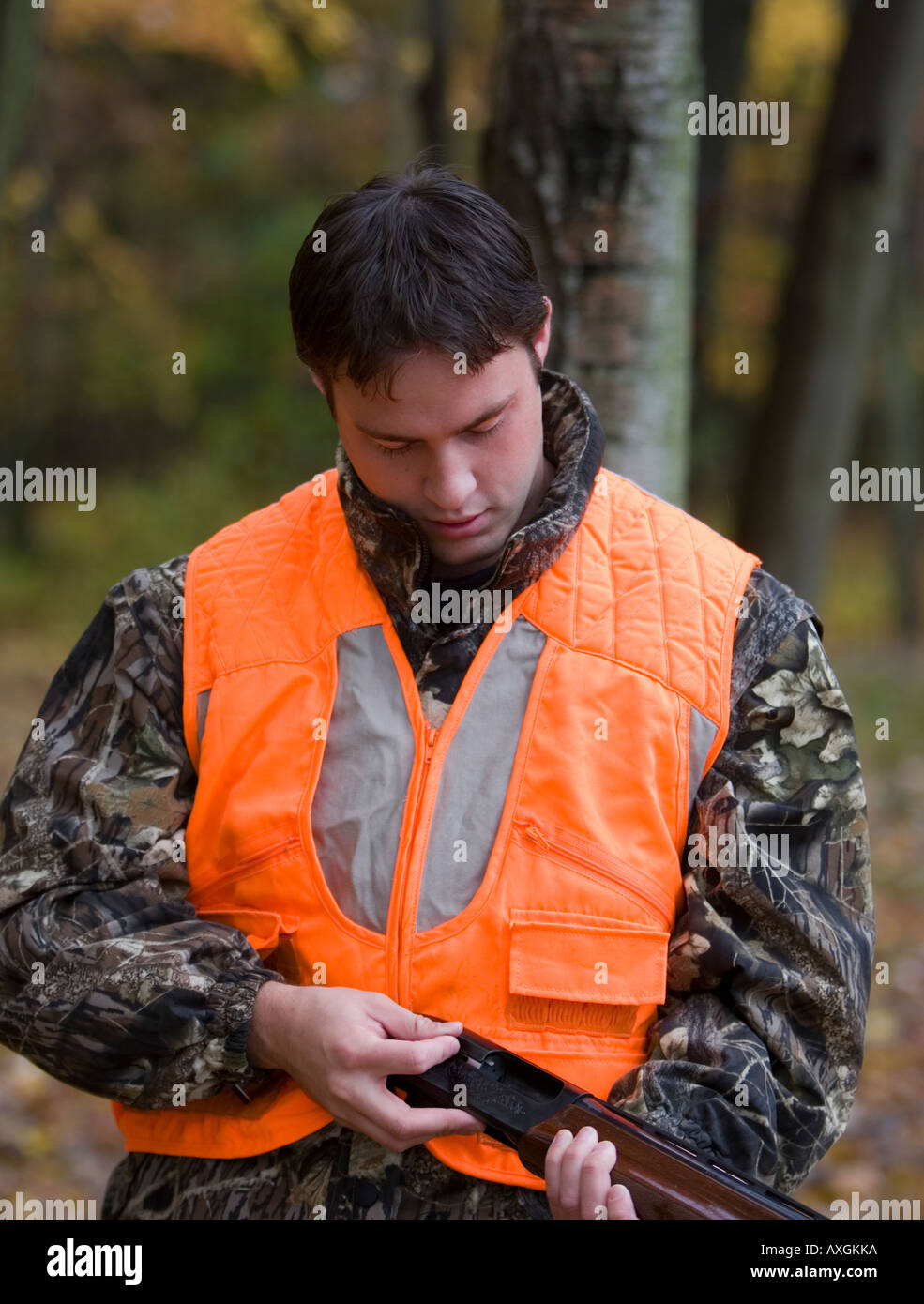 Hunter loading a rifle Stock Photo - Alamy