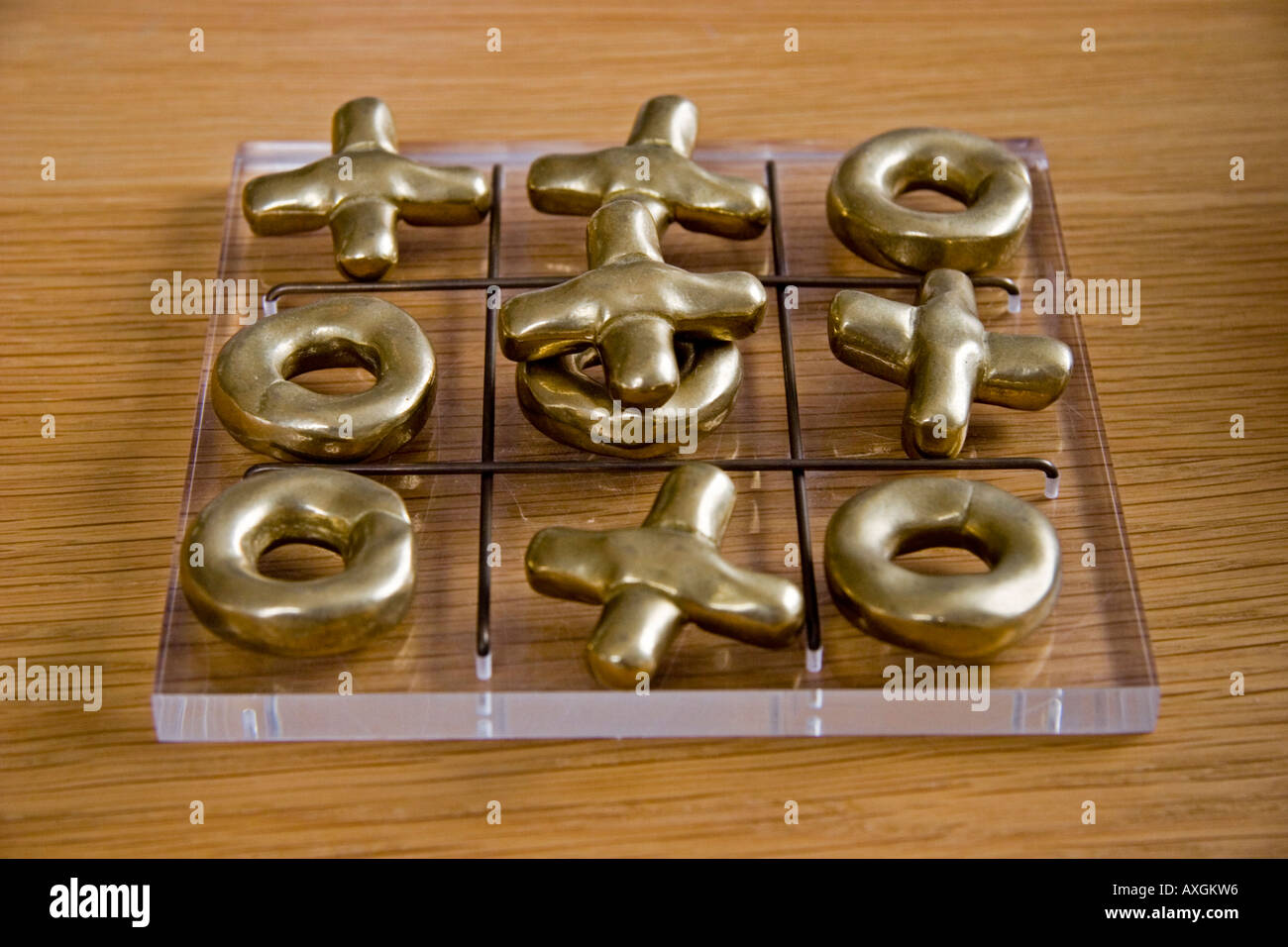 ornamental noughts and crosses game on a wooden table Stock Photo - Alamy