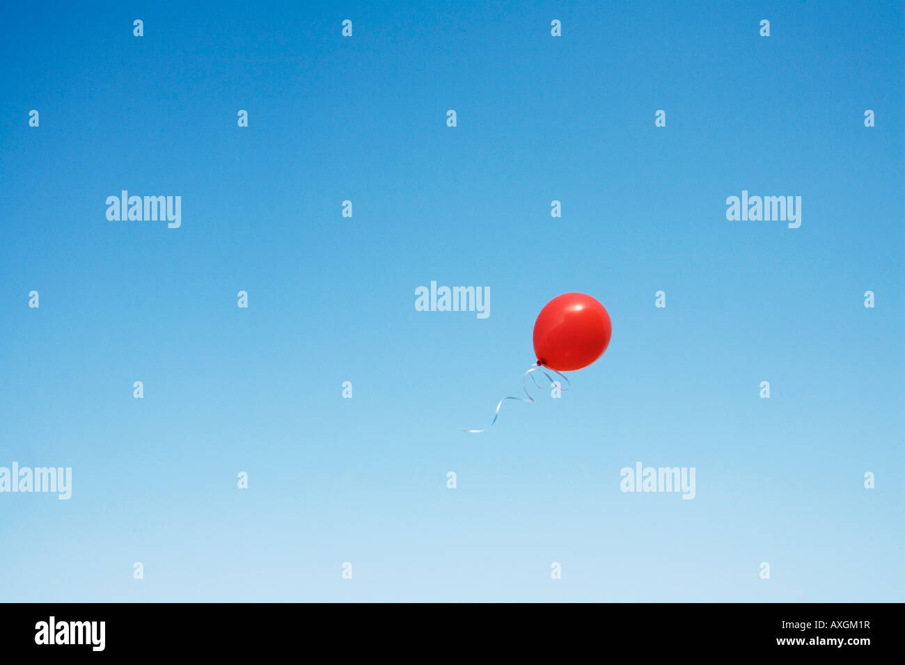 Red Balloon in Sky Stock Photo - Alamy