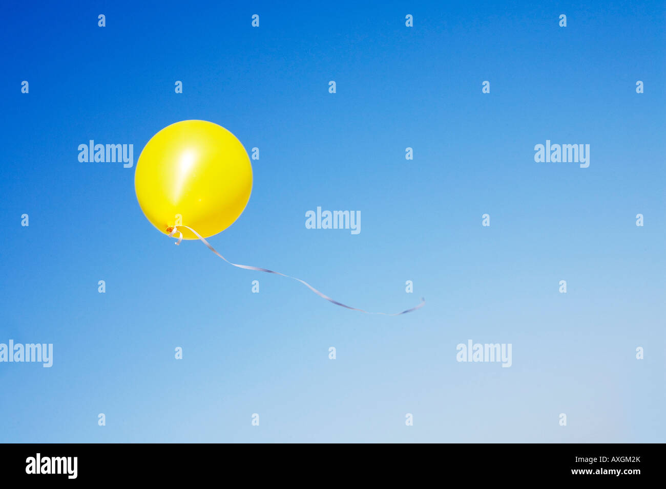 Yellow Balloon in Sky Stock Photo - Alamy
