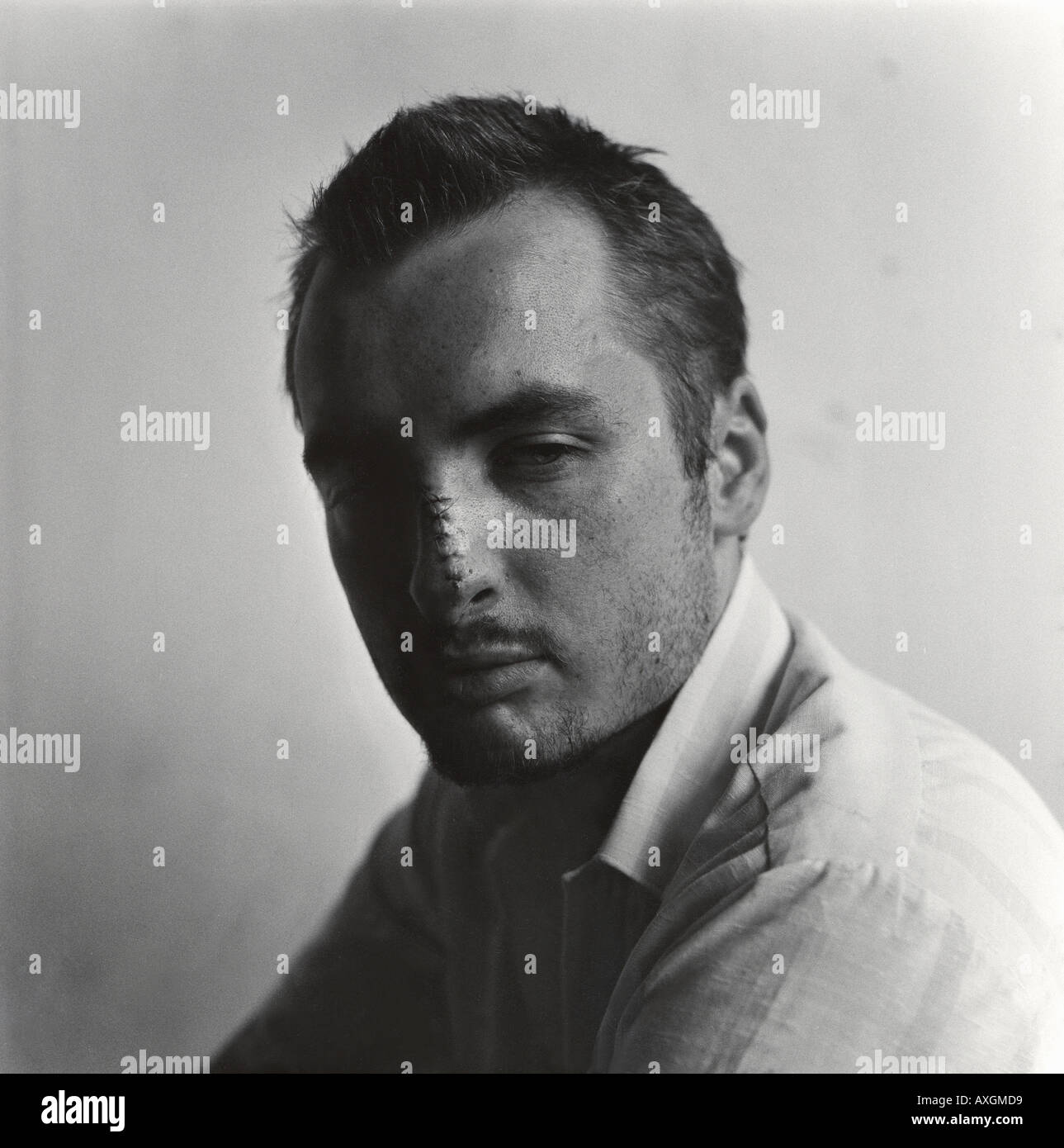 indoor studio man young 25 30 mustache seam scar nose wound cut injury ...