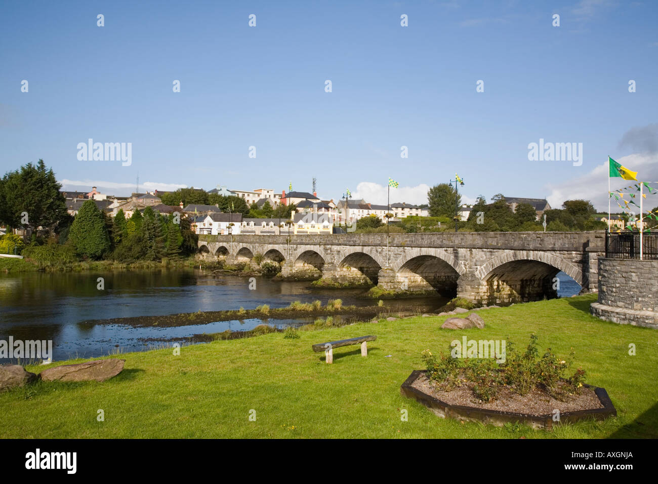 Killorglin town and arched stone road bridge from public gardens across ...