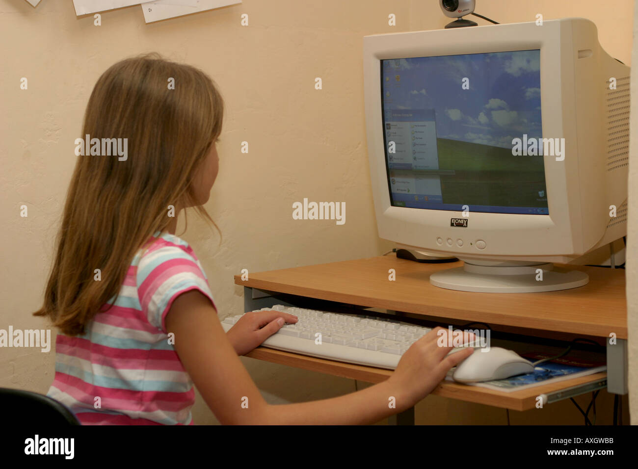 A child working on her computer Stock Photo - Alamy