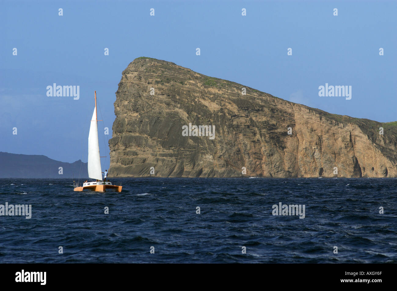 catamaran sailing in front of gunner’s quoin rock Stock Photo - Alamy