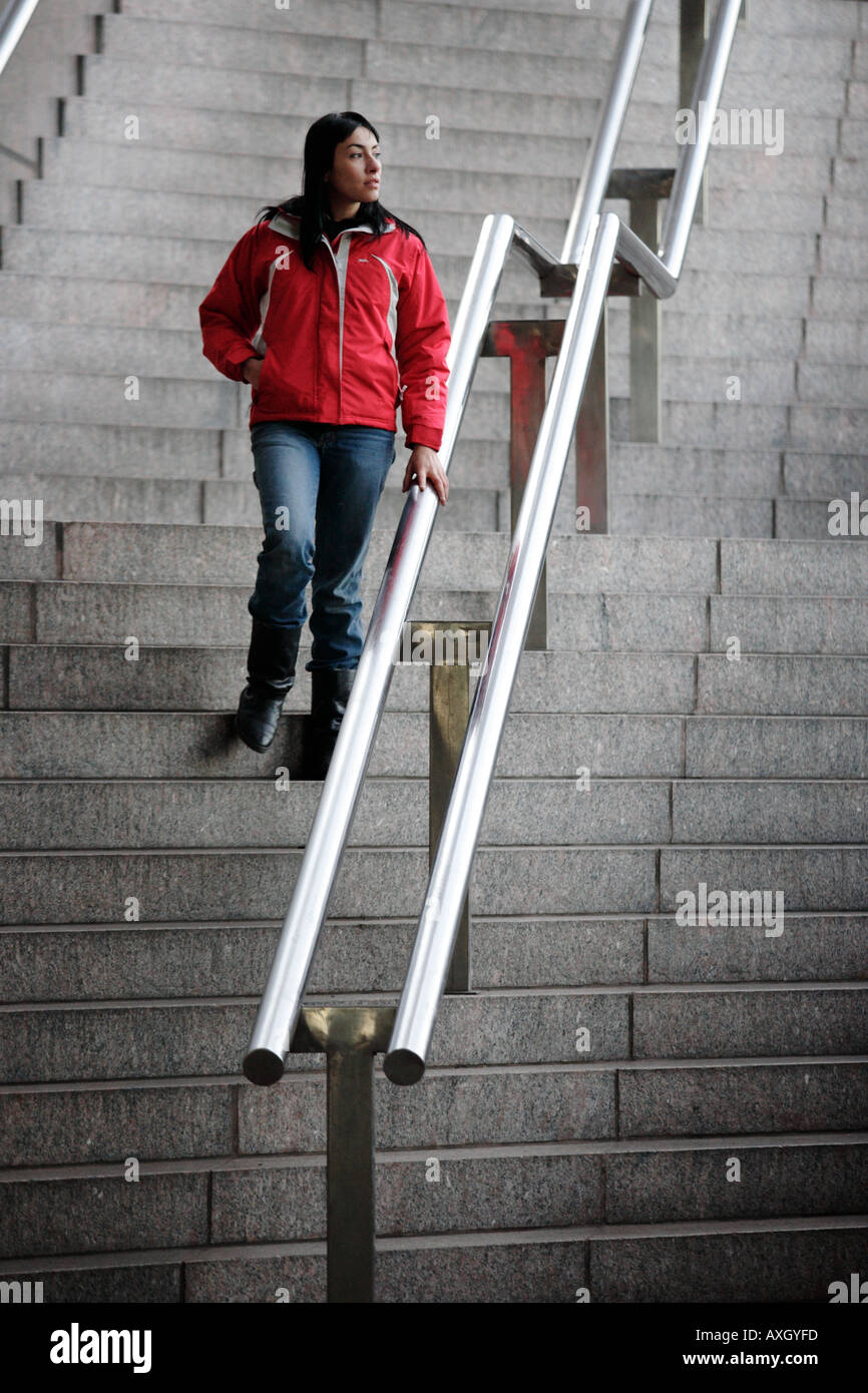 Woman descending stone stairs hi-res stock photography and images - Alamy
