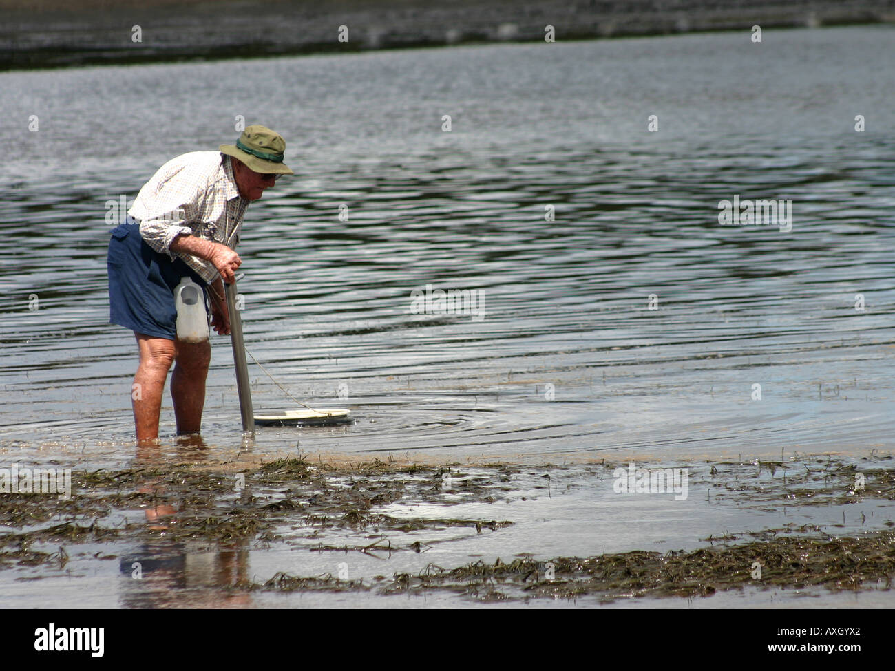 OLD MAN CATCHING BAIT SIDE VIEW HORIZONTAL BAPDB9452 Stock Photo - Alamy