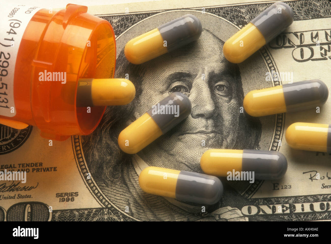 medical capsules displayed on a 100 dollar bill USA concept Stock Photo ...