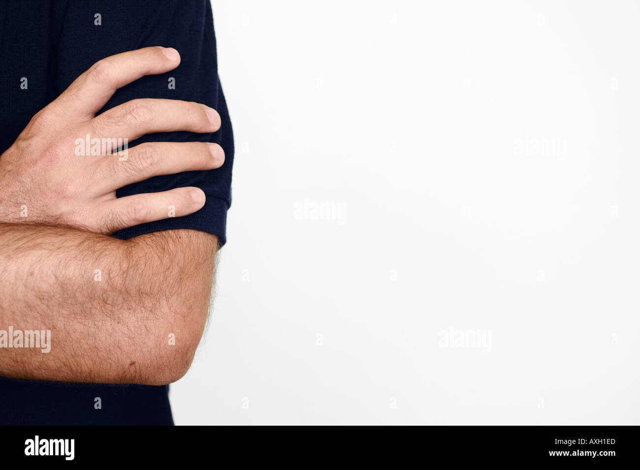 Detail Of Man With Folded Arms Stock Photo - Alamy