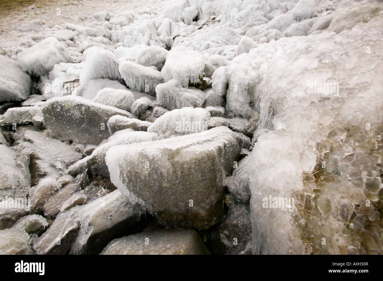 Icing on rocks caused by a strong wind blowing water onto frozen rocks ...