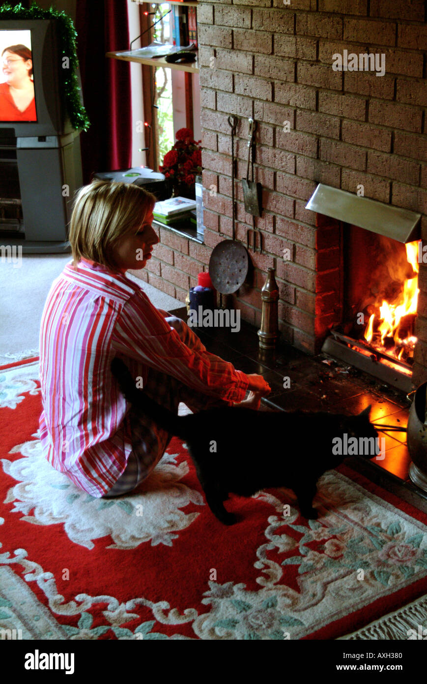 Warming in front of open fire hi-res stock photography and images - Alamy