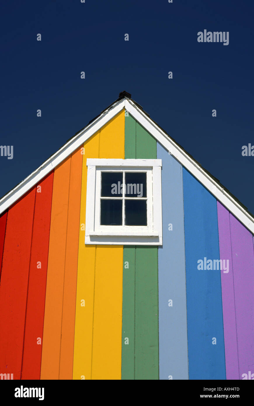 Little house gable wall painted in rainbow colored vertical bands with ...