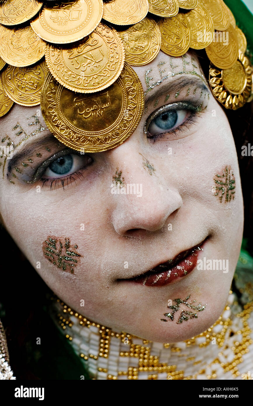 Portrait of a Muslim girl in traditional religious costume with ...