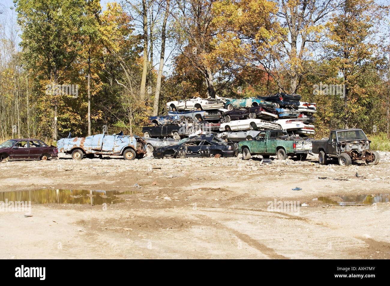 Wrecked cars parked at junkyard Stock Photo - Alamy