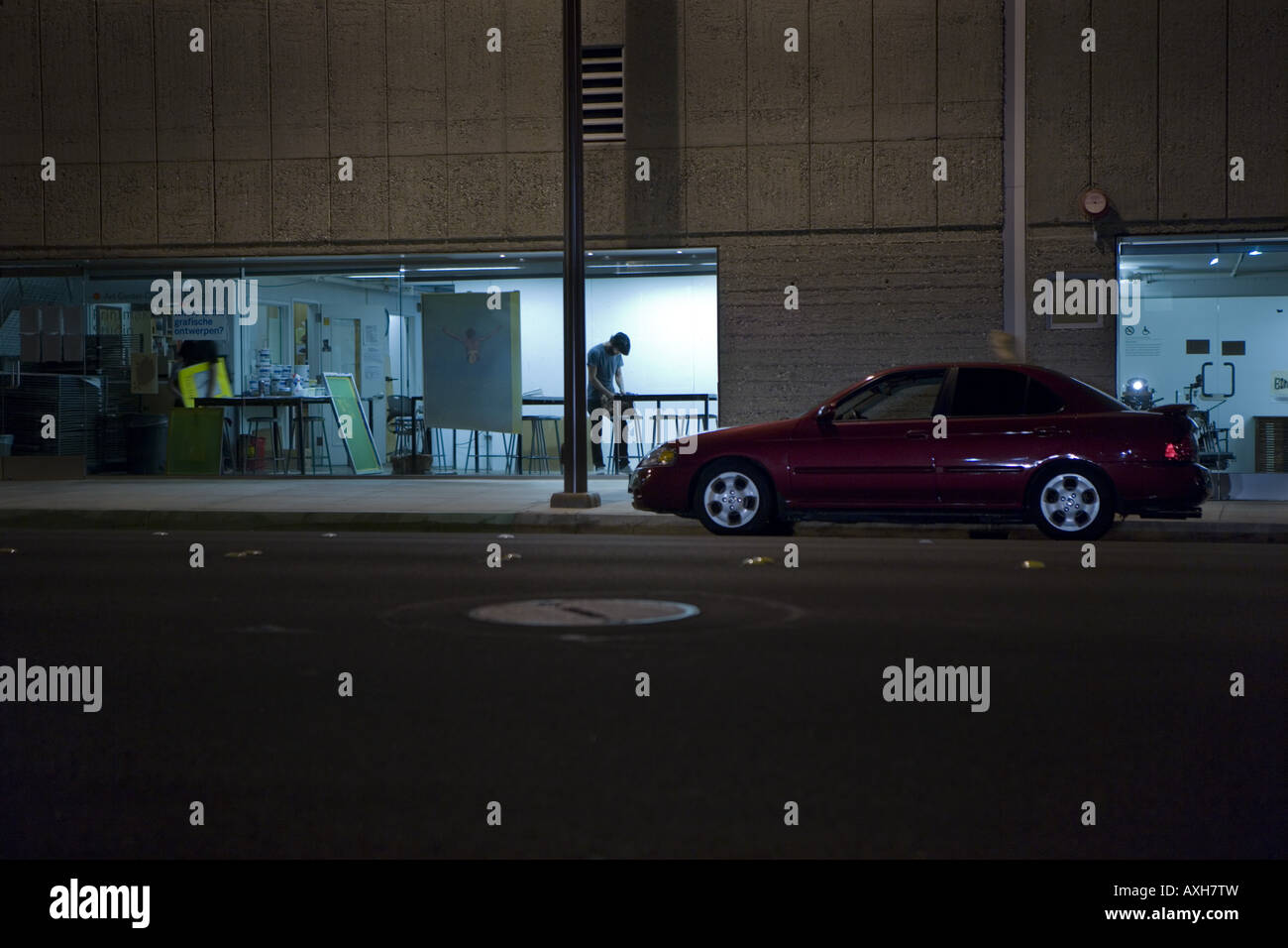 People working in lower level of office building Stock Photo - Alamy