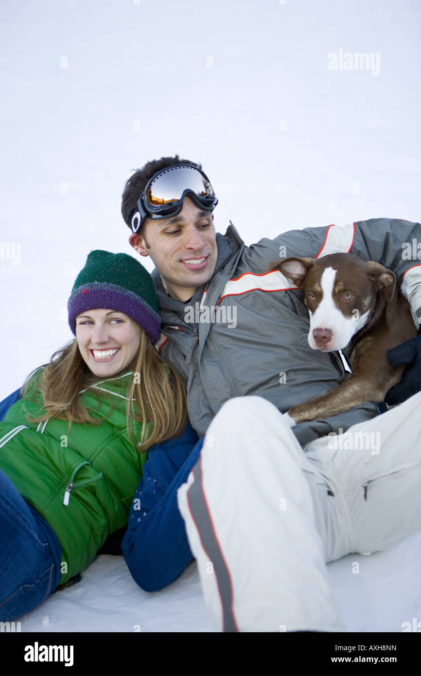 Couple with dog on slope Stock Photo - Alamy