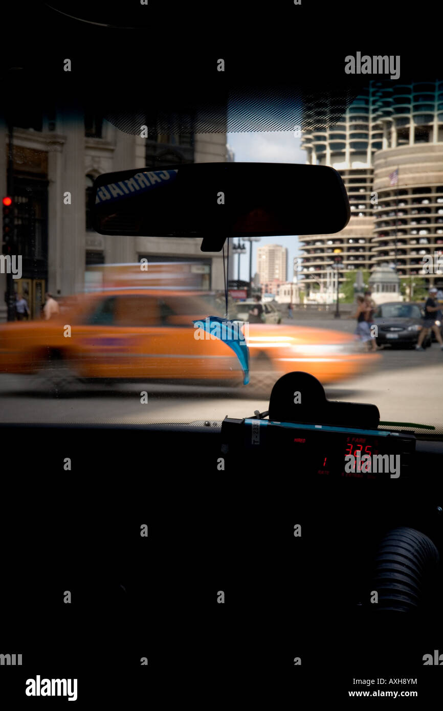 view trough the window side of a cab on another cab driving by Stock ...