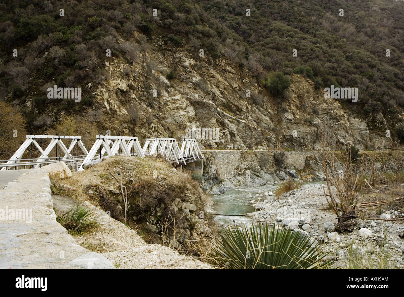 Bridge crossing stream on mountain road Stock Photo - Alamy