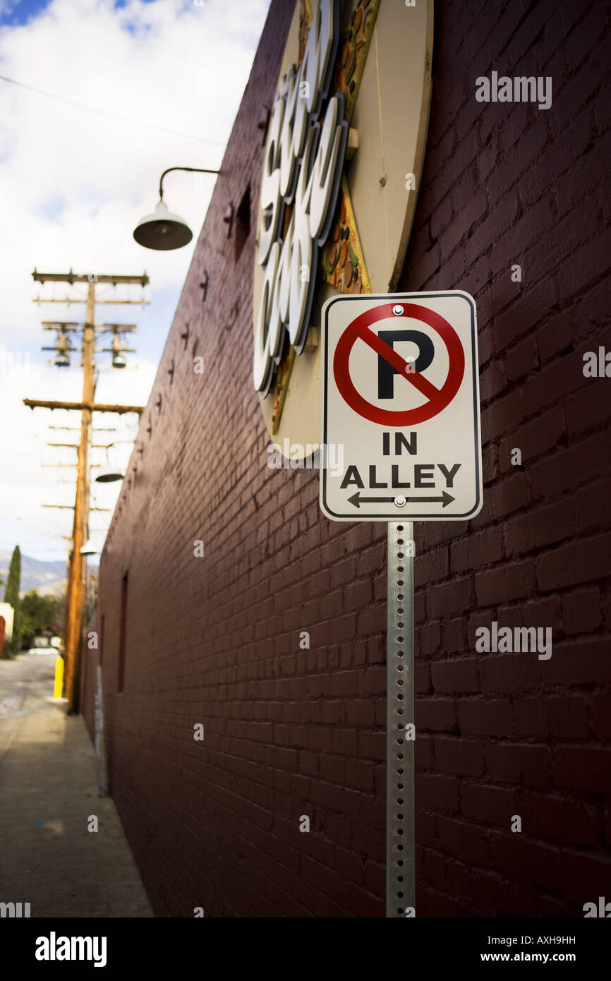 "No Parking" sign post next to building Stock Photo - Alamy