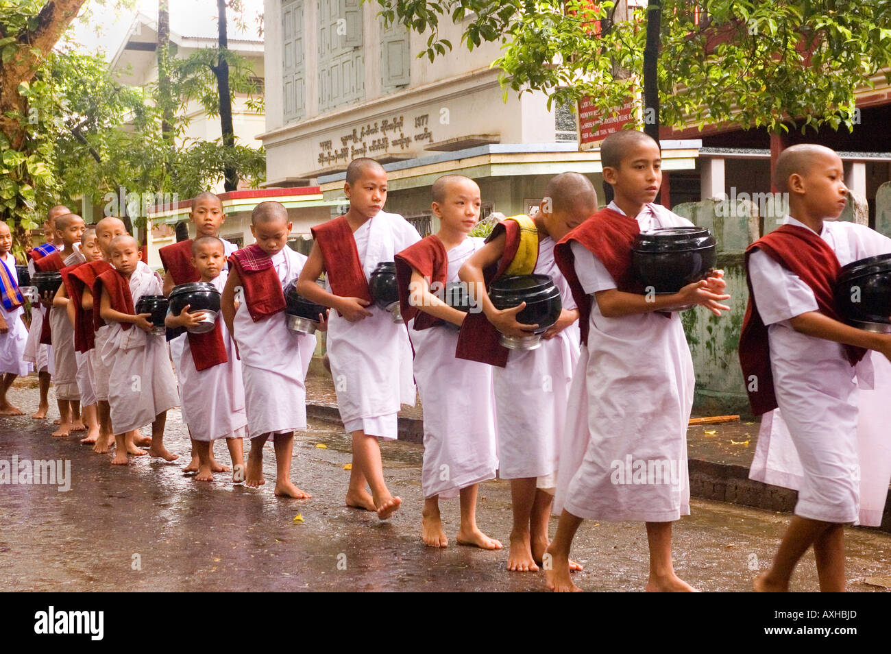 Young Burmese novice monks in line for their daily meal at Maha Ganayon ...