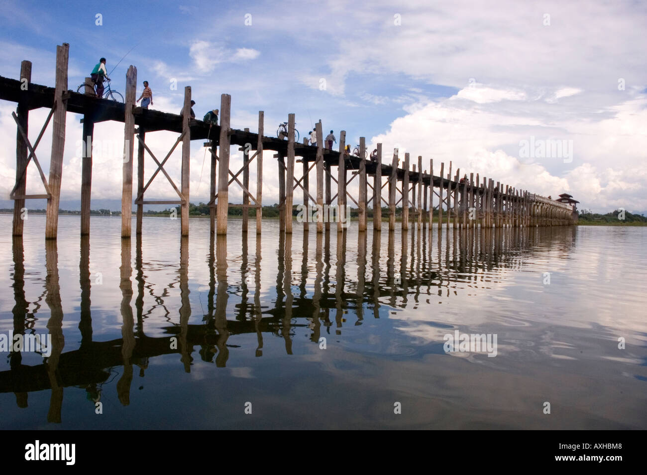 Stock photograph of the U Bein old teak bridge across Taungthaman Lake ...