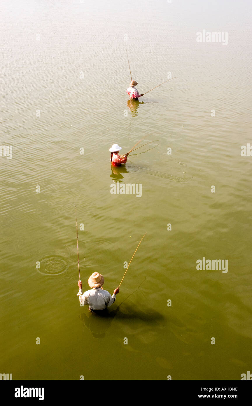 Stock photograph of fishermen in chest deep water at Taungthaman Lake ...