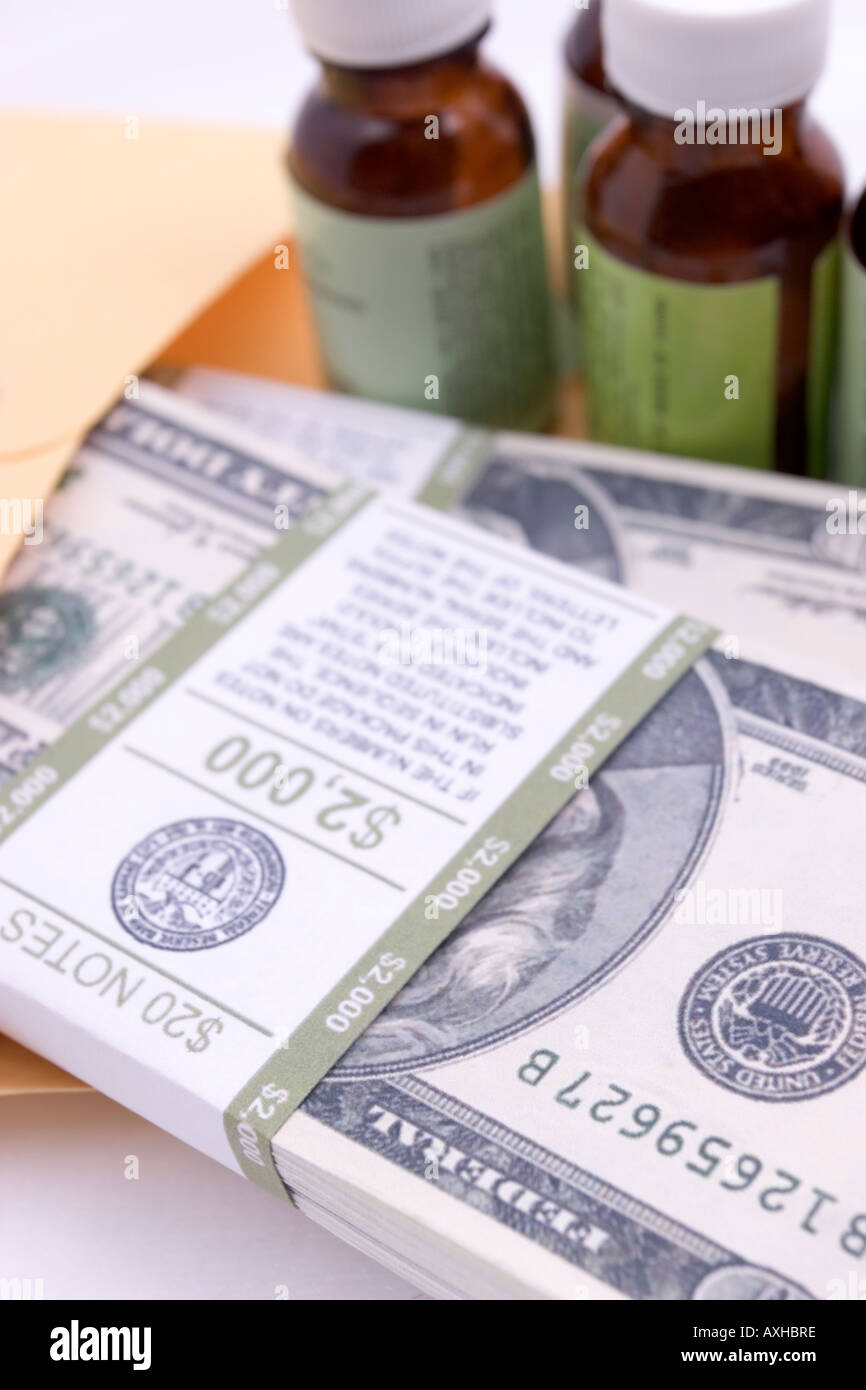 Bundles of US currency in envelope next to bottles of poison Stock ...