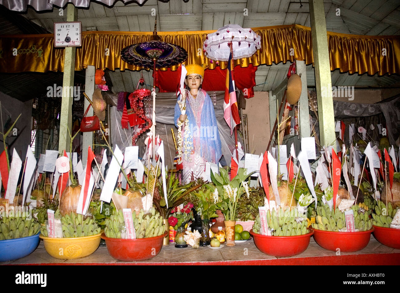 Stock photograph of offerings and idols at the Bo Bo Gyi Nat Shrine at Hsipaw in Myanmar 2006 ...