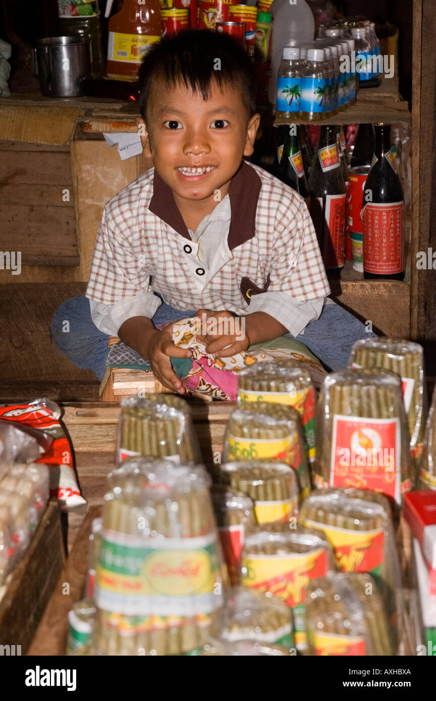 Stock photograph of a cute young boy at a stall selling cheroots at ...