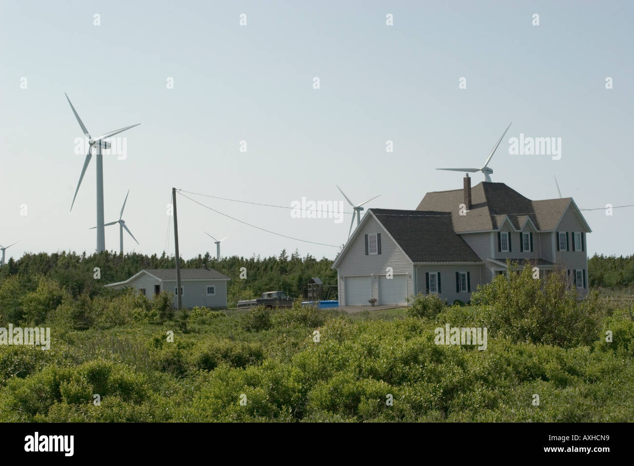 Wind turbines next to house, Prince Edward Island Canada Stock Photo ...