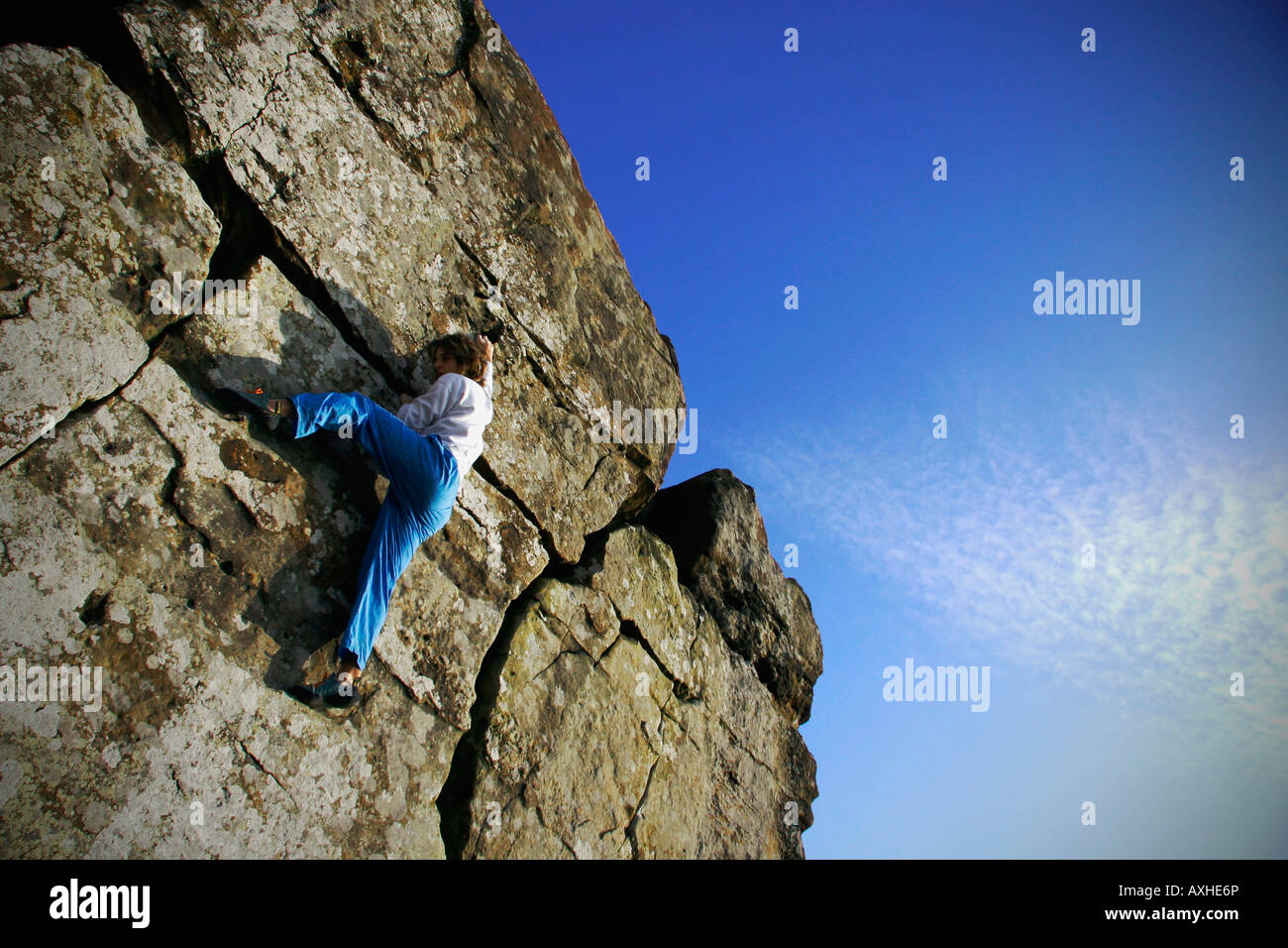 Rock climber blue sky Stock Photo - Alamy