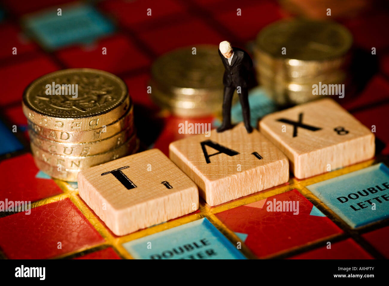 Tax man and coins Stock Photo - Alamy