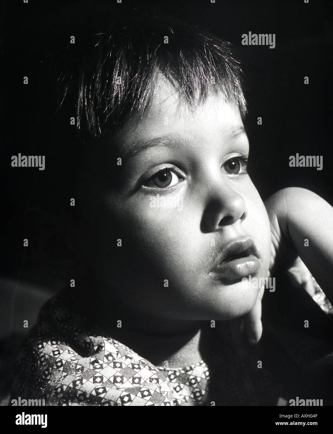 Portrait of a small, sad boy Stock Photo - Alamy