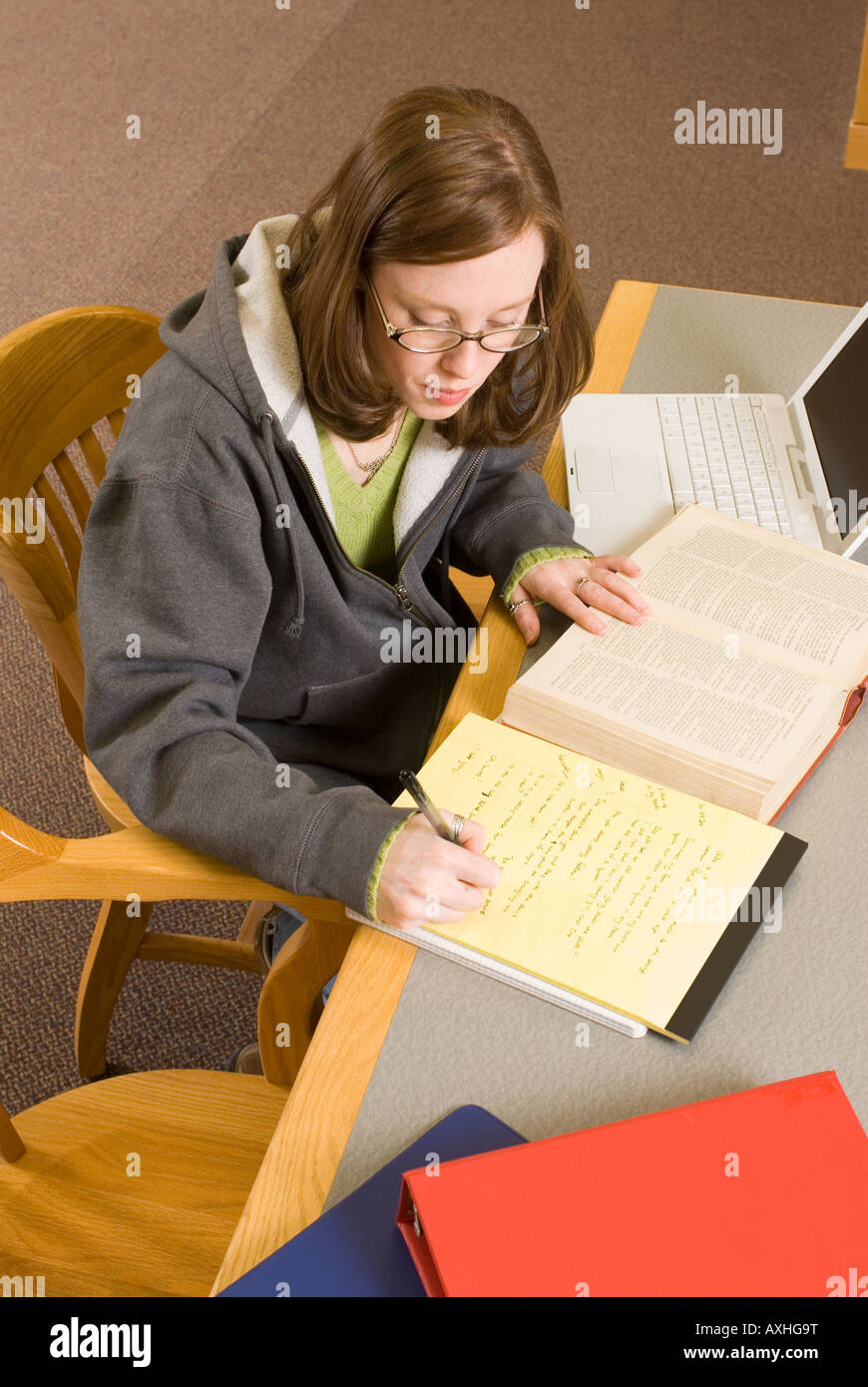 a young woman studies in the library Stock Photo - Alamy