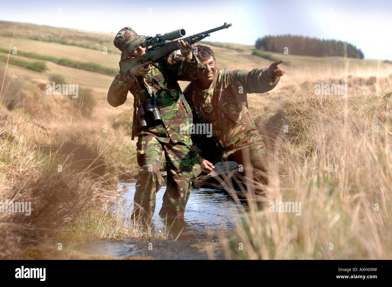 A BRITISH ARMY FEMALE UNDER INSTRUCTION FROMA COLOUR SERGEANT ON A ...