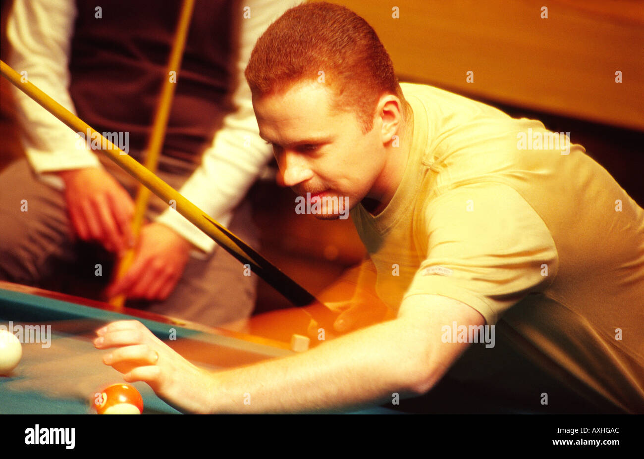 Two men playing billiards Stock Photo - Alamy