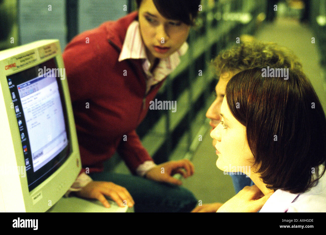 A group of young students using computer in a public library Stock ...